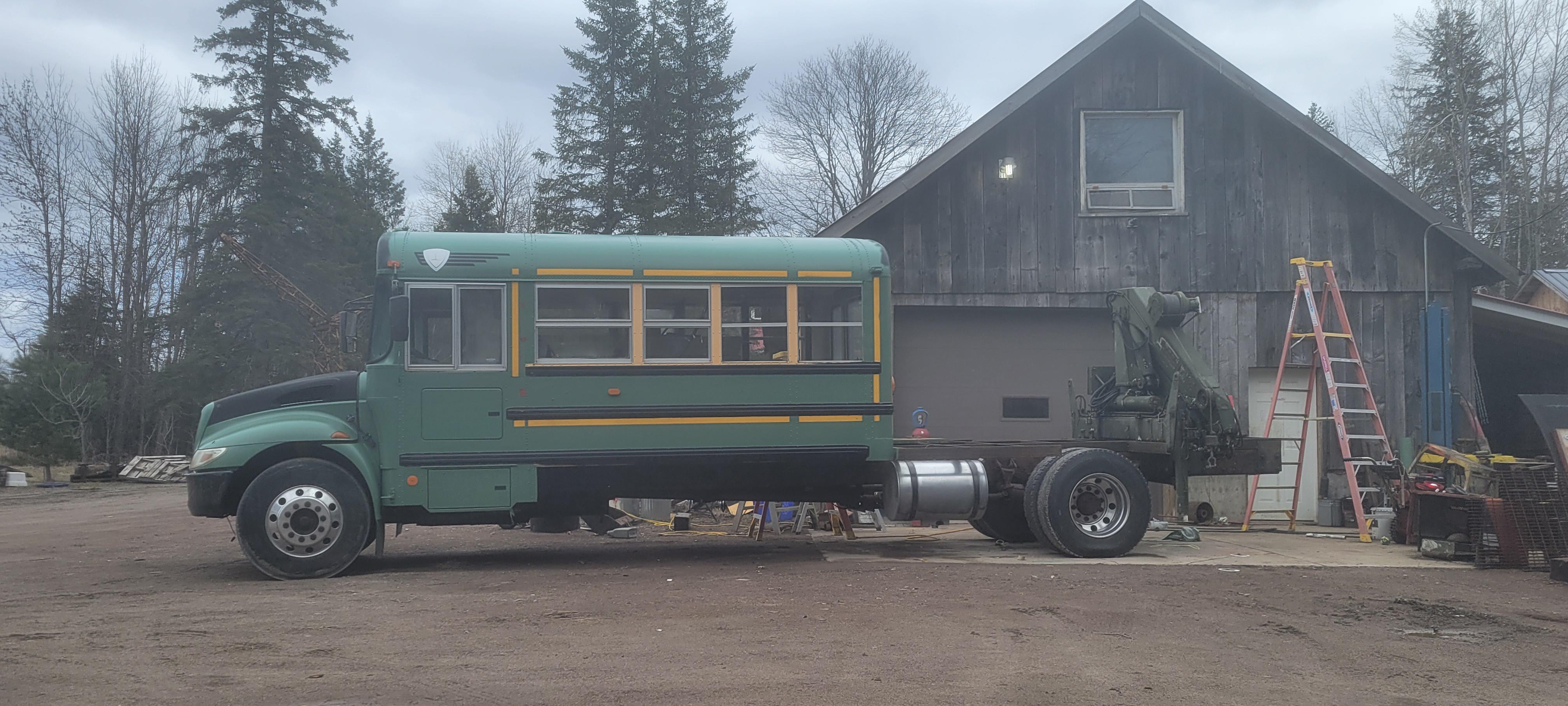School bus with knuckle boom crane - photos